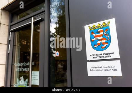 28 May 2025, Hesse, Gießen: A police car is parked in front of Giessen ...