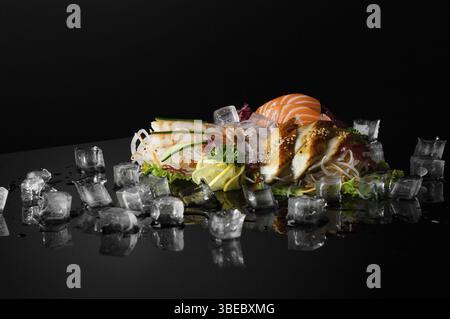 Set of sushi with pieces of melting ice on a black background with ...