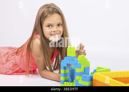 Seven-year girl builds a house from the block designer Stock Photo - Alamy