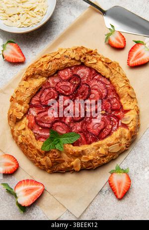 homemade strawberry Galette with fresh ripe strawberries on a dark ...