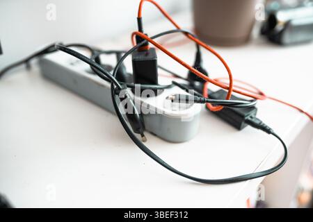 Overloaded power board at home or office Stock Photo - Alamy