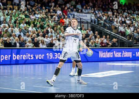Niels Versteijnen (TBV Lemgo Lippe, #25) jumps to score a goal, Foot ...