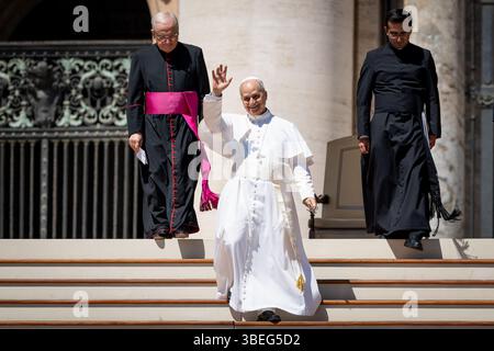 Pope Leo XIV greets the faithful after leading the Angelus prayer from ...