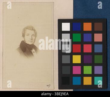 Mounted studio portrait of a European man sitting on a rock with ...