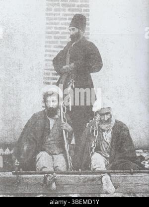 This photograph captures Persian servants in Iraq during the time of ...