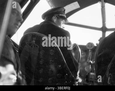 1930s Berlin: Radio operator and pilots in the cockpit of the Fokker F ...