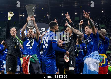 27che lifts the trophy as teammates celebrate during the award ceremony ...