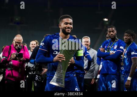 Reece James of Chelsea FC lifts the trophy as his teammates celebrate ...