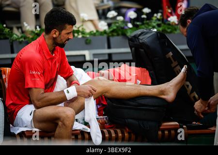Novak Djokovic of Serbia looks on during a break of the first round men ...