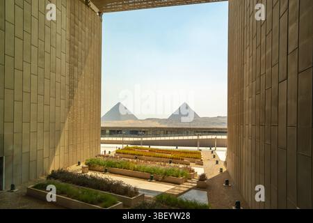 View of Giza Pyramids from the interior of the Grand Egyptian Museum ...