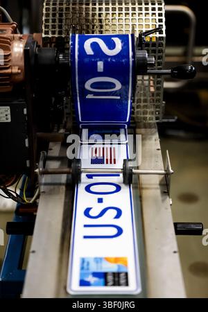 A license plate for the United States delegation is being printed ahead ...