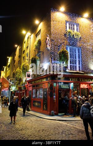 Brick facade of the Temple Bar Pub with a Christmas tree and festive ...