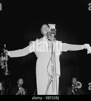 Louis Armstrong (1901-1971), African American Jazz musician, conducting ...