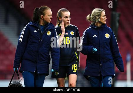 Scotland's Amy Rodgers leaves the pitch after picking up an injury ...
