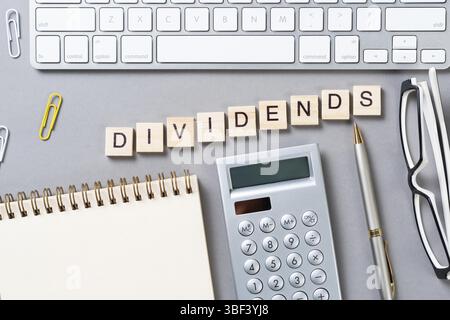 Dividends payment concept with letters Stock Photo - Alamy