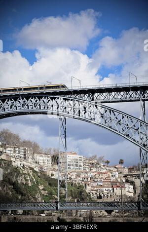A vertical shot of a train bridge over a river in the Netherlands going ...