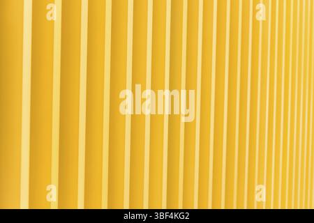 Detail of bright yellow metal building facade. For background Stock ...