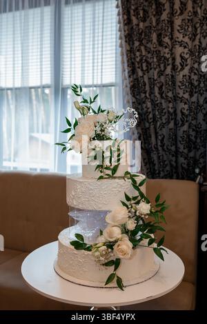 Elegant cake adorned with delicate greenery Stock Photo - Alamy