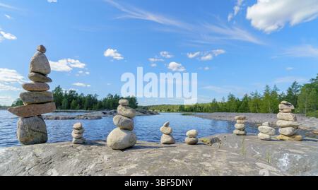 Pyramid of stones. Unstable balance of stone objects. Idyllic state of ...