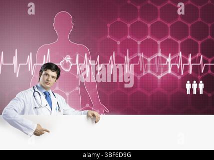 Young handsome doctor holding white blank banner. Place your text Stock ...