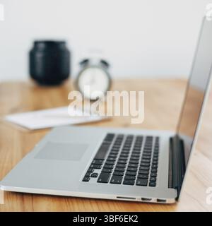 Comfortable working place in home office with wooden table and modern ...