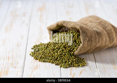 Green mung beans in sack bag. Sack with organic mung beans . Mung beans ...