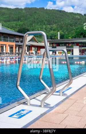 Pool handrails entrance into the pool Stock Photo - Alamy