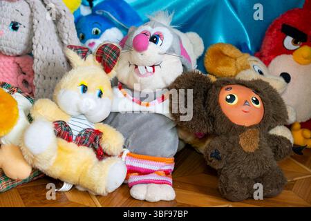A variety of plush animal toys, including Beanie Babies, are neatly ...