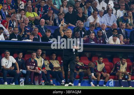 PSG's head coach Luis Enrique sits on the bench prior to the start of a ...