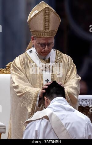 Pope Leo XIV blesses the faithful at the end of a Mass in St. Peter's ...