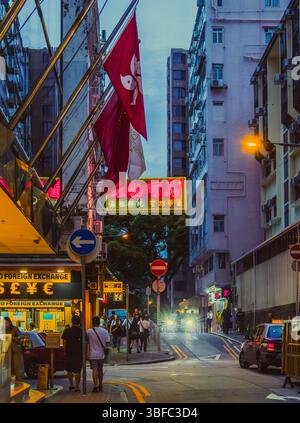 Colorful neon advertisement signs along buildings and businesses ...