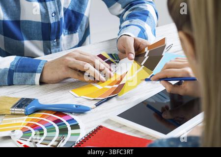 Interior designer choosing colors from swatches Stock Photo - Alamy