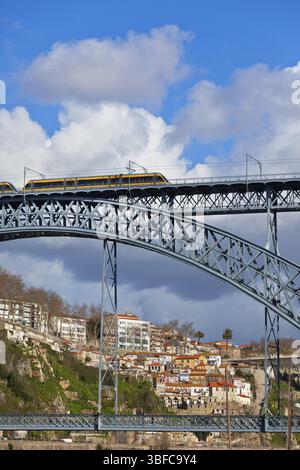 A vertical shot of a train bridge over a river in the Netherlands going ...