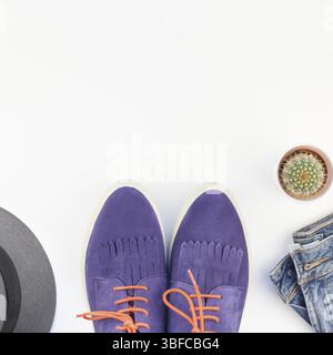 Square Flat lay of suede shoes, blue jeans, cactus and smartphone with ...