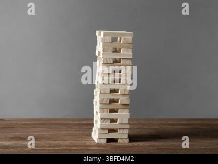 Tower from wooden blocks standing on table Stock Photo - Alamy