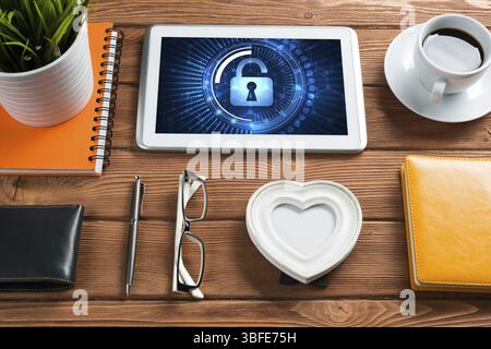 Business workplace with office stuff and tablet with padlock icons on ...