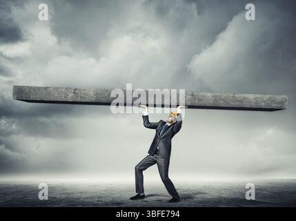 Engineer man in suit and helmet lifting wall above head Stock Photo - Alamy