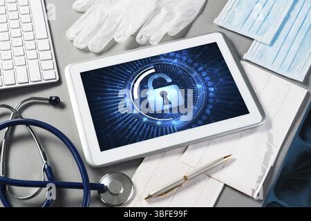 Web security and technology concept with tablet pc on wooden table ...
