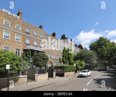 Cheyne Walk in Chelsea, a historic street facing the Thames River, with ...