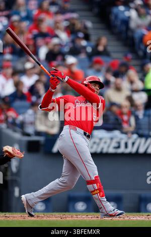 Los Angeles Angels' Yoan Moncada, left, is congratulated by first base ...