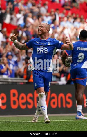 Joe Garner of Oldham Athletic celebrates scoring his side's second goal ...