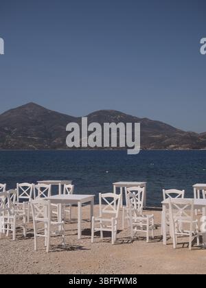 Dining table with chairs placed near living room with decorative ...