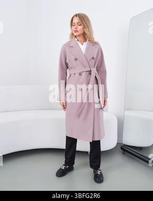 Stylish blonde woman models trendy denim outfit with modern flair and ...