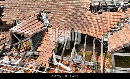 an old collapsed tiled roof as an aerial photograph Stock Photo - Alamy