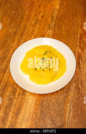 Papa a la huancaína: Boiled potatoes covered in a creamy sauce made ...