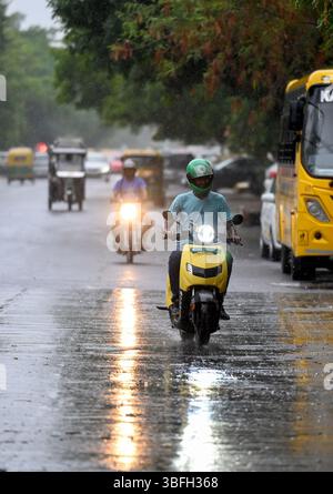 NOIDA, INDIA - JUNE1: Commuters during rain in Sector 27. Light Rain in ...