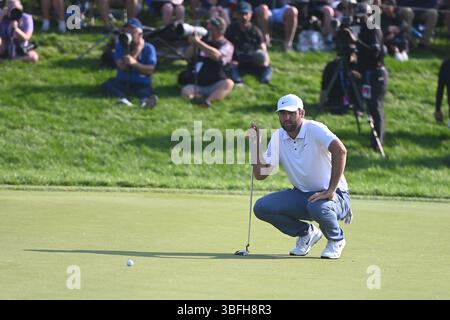 Scottie Scheffler prepares to putt on the 9th green during the first ...