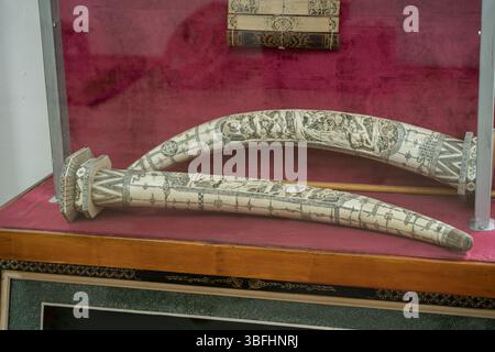 Two fangs made of bone and carved ivory with figures and dragons, China ...