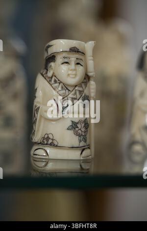 A rare circa 1890 (Meiji Period) hand-carved bone netsuke sculpture of ...