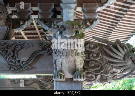 Intricate wooden dragon carving adorns Daisho-in Temple, blending ...